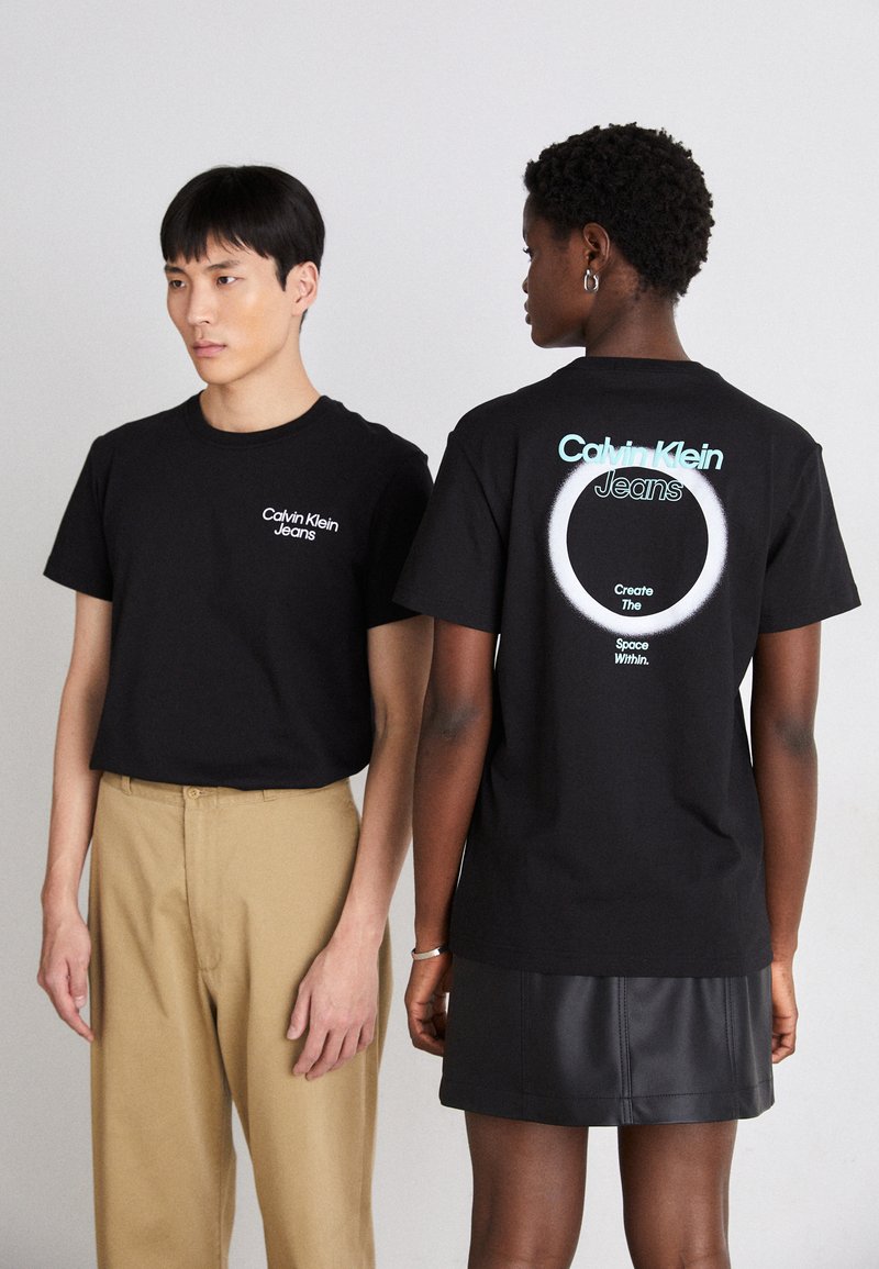 Calvin Klein Jeans ECLIPSE GRAPHIC TEE UNISEX - Print T-shirt - black ...