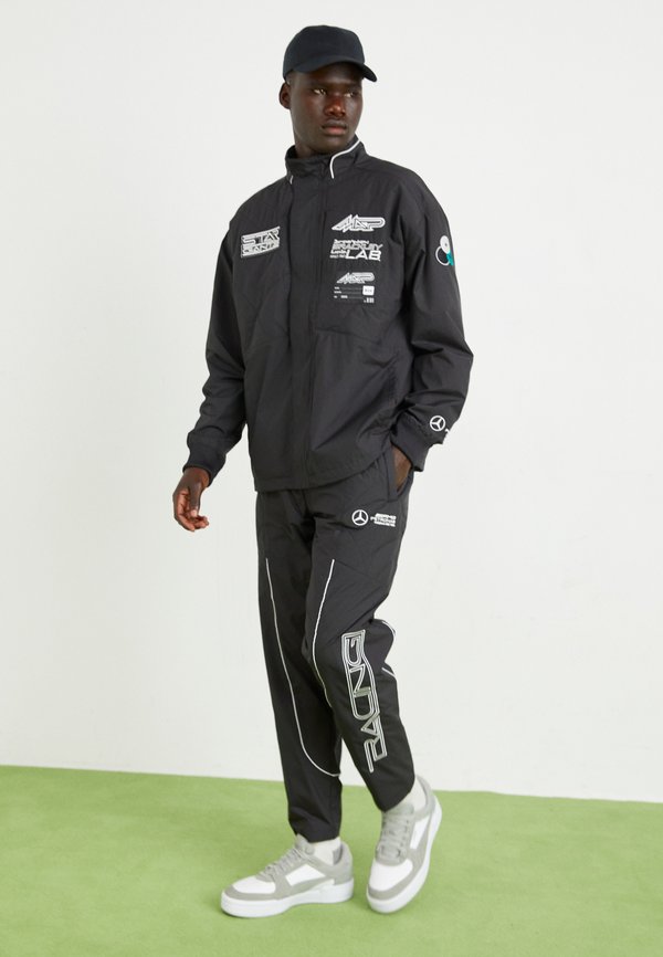 Puma GARAGE PANTS - Tracksuit bottoms - black - Zalando.co.uk