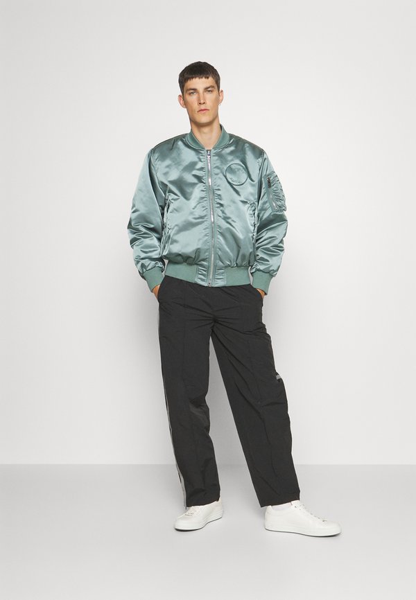 Weekday KEN TRACKPANTS UNISEX - Pantalones - black/negro - Zalando.es