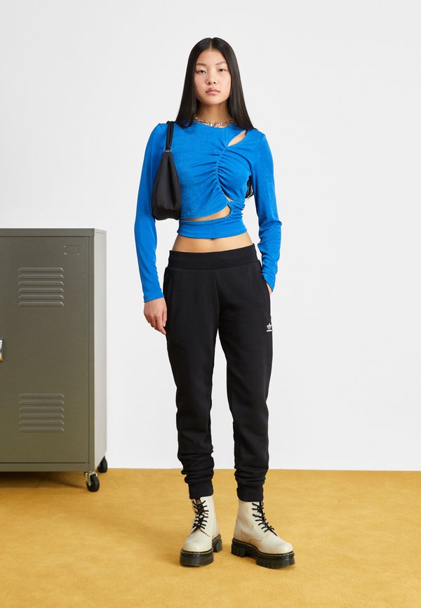 adidas Originals SLIM CUFFED JOGGERS - Tracksuit bottoms - black ...