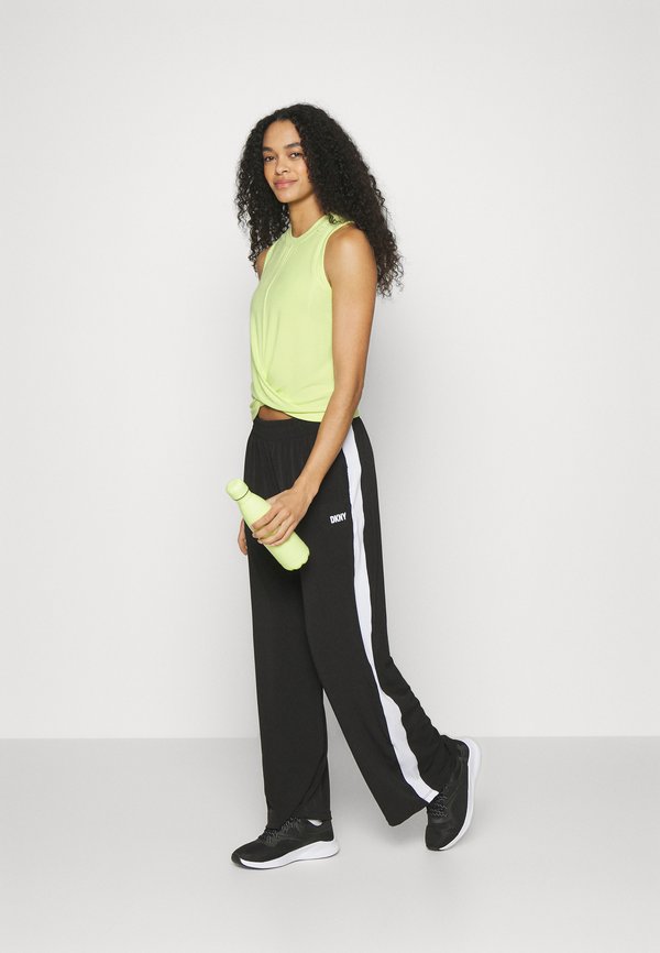Puma MODEST ACTIVEWEAR WIDE LEG PANT - Jogginghose - black/schwarz ...