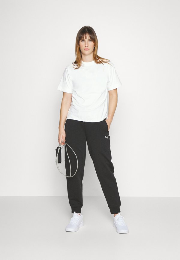Puma MODEST ACTIVEWEAR WIDE LEG PANT - Jogginghose - black/schwarz ...