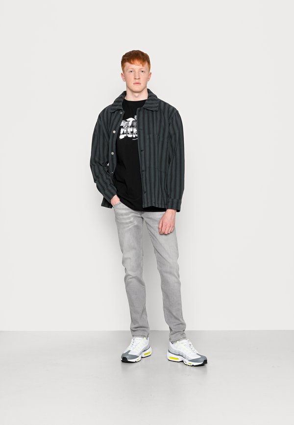 Replay ANBASS HYPERFLEX REUSED - Jean slim - super light grey/denim ...